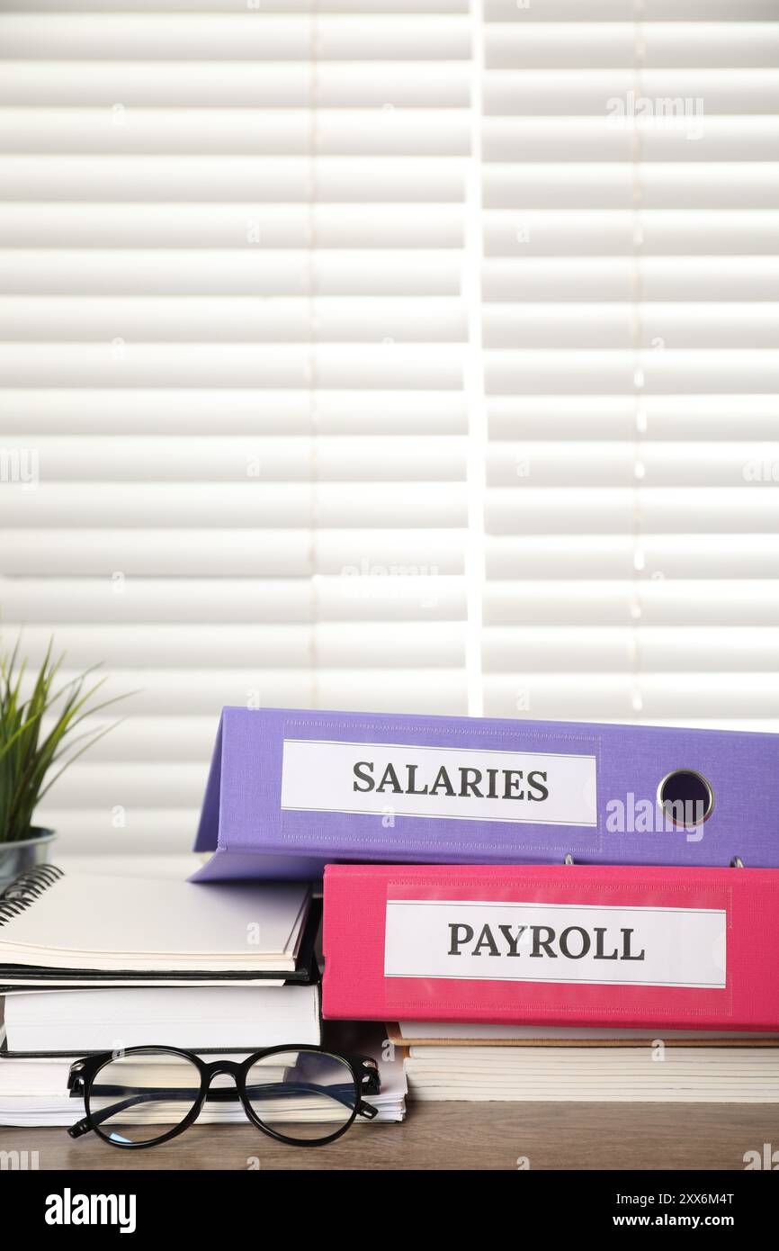Folders with payroll accounting hi-res stock photography and images - Alamy