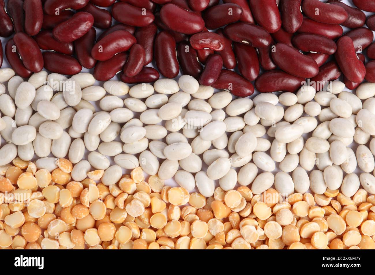 Different types of legumes as background, top view Stock Photo - Alamy