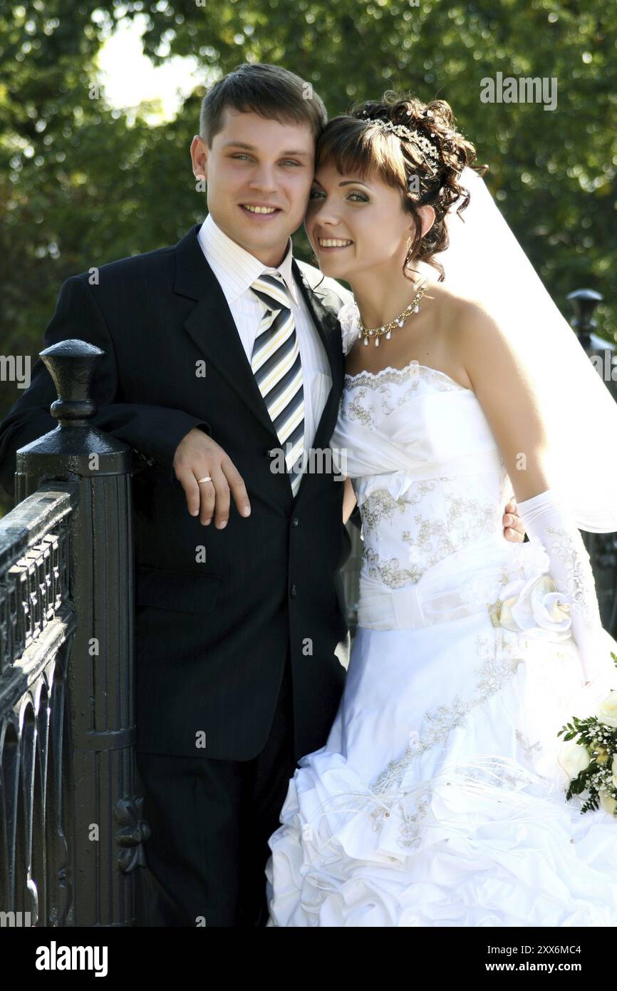 Newly married together in a photo pose Stock Photo - Alamy