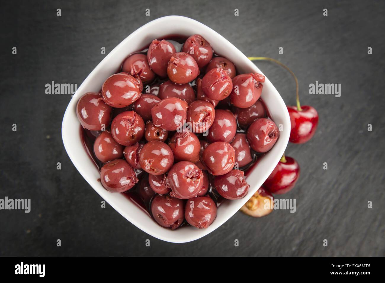 Fresh made Canned Cherries on a vintage background as detailed close-up ...