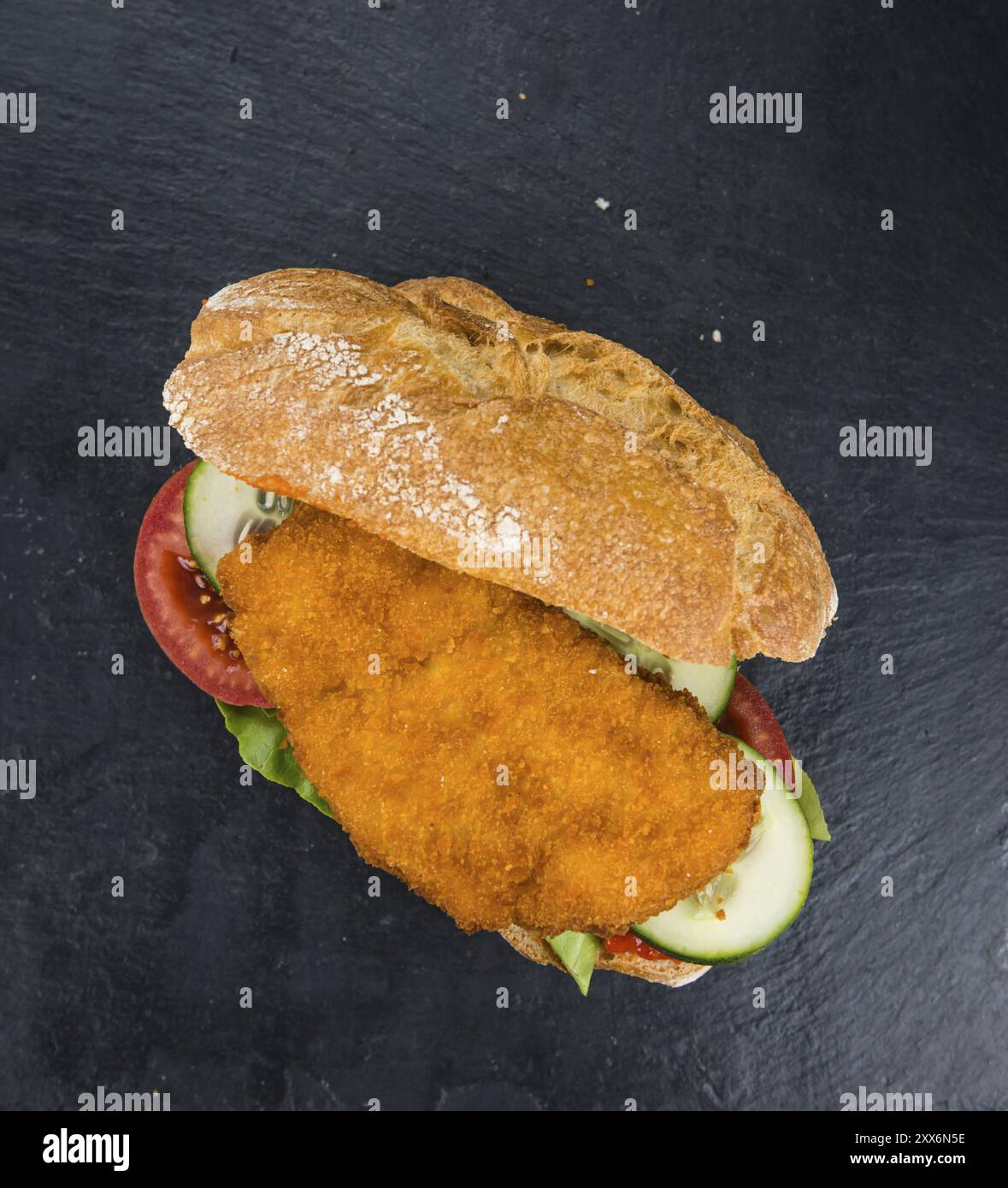 Fresh made Chicken Schnitzel on a bun (close-up shot, selective focus ...