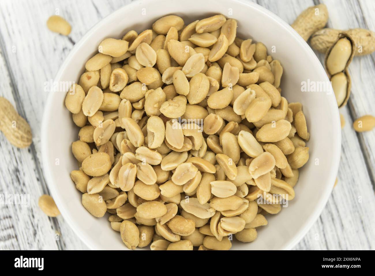Portion of roasted and salted Peanuts (close-up shot, selective focus ...