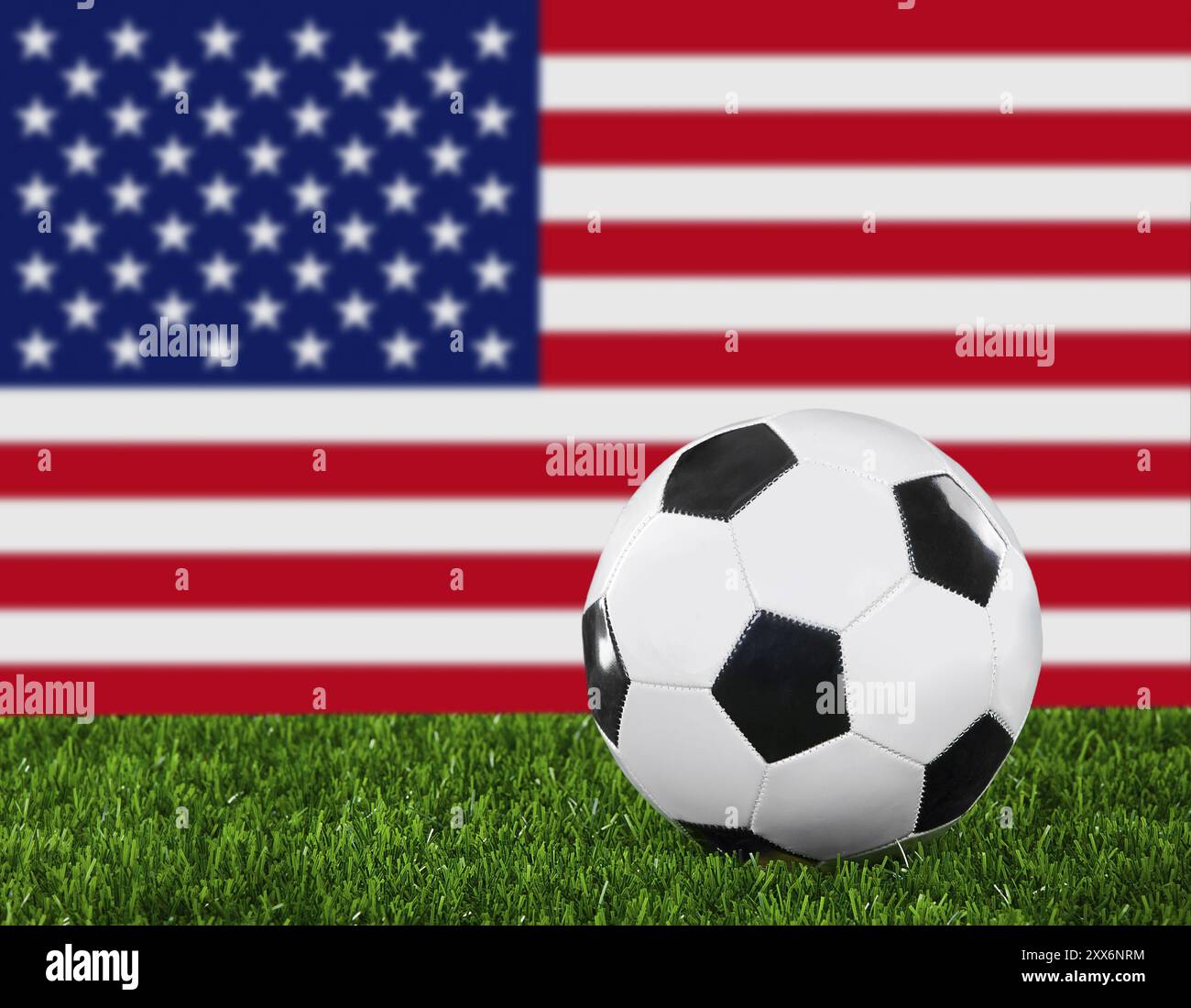 The USA flag and soccer ball on the green grass Stock Photo - Alamy