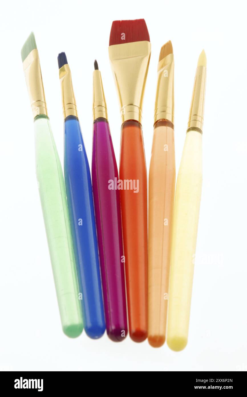 Set of colored brushes isolated on white Stock Photo - Alamy