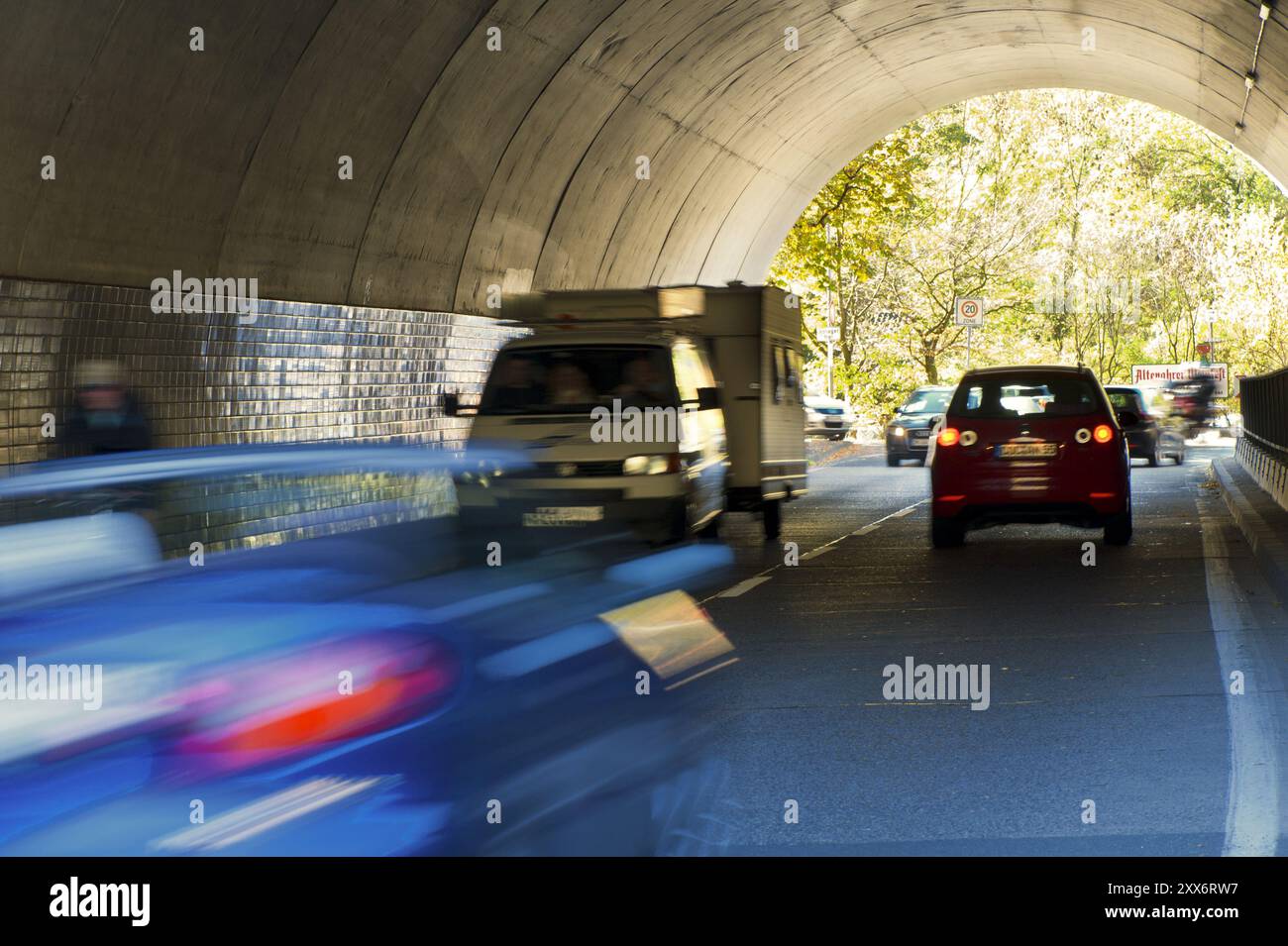 Cars drive through a tunnel Stock Photo - Alamy