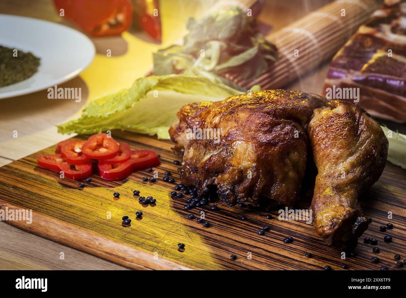 Still life with roasted chicken leg on a kitchen countertop and other ...