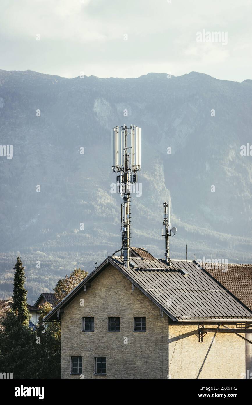 Communication transmitter on the rooftop of a house Stock Photo - Alamy