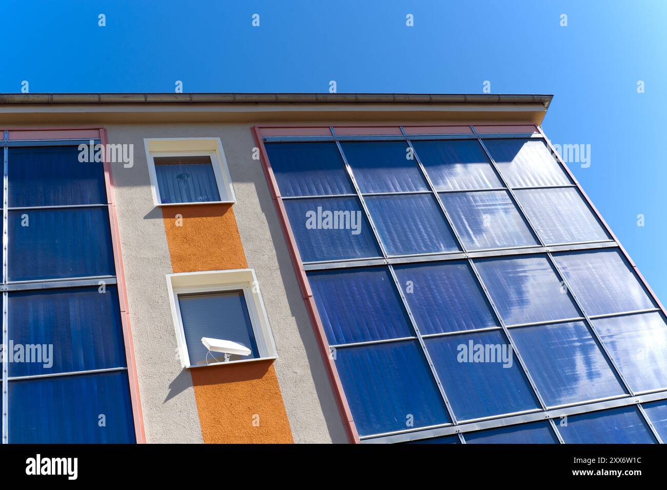 Apartment block with solar cells on the gable wall Stock Photo - Alamy