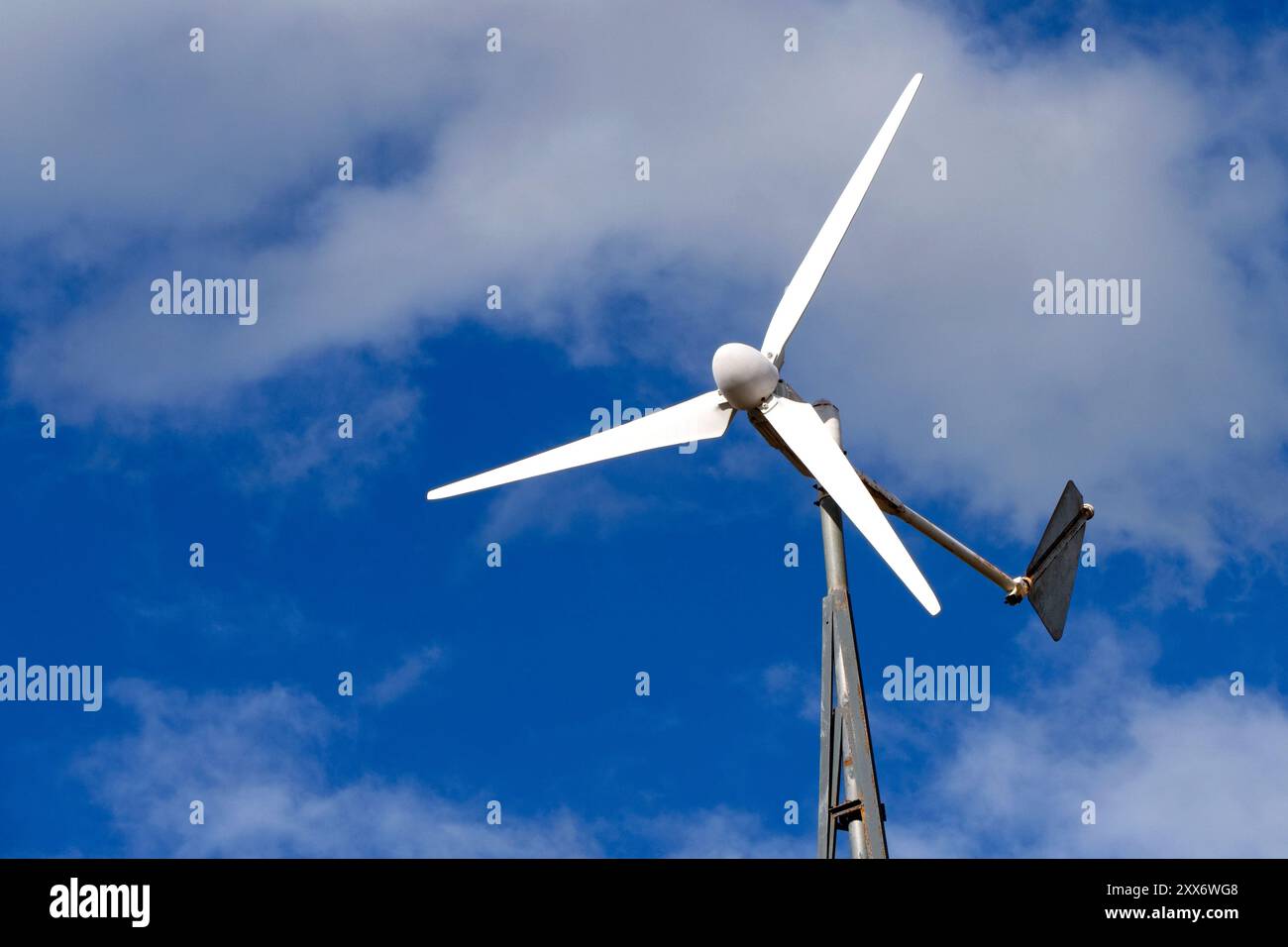 Small wind mill against cloudy blue sky, Meckering, Western Australia ...