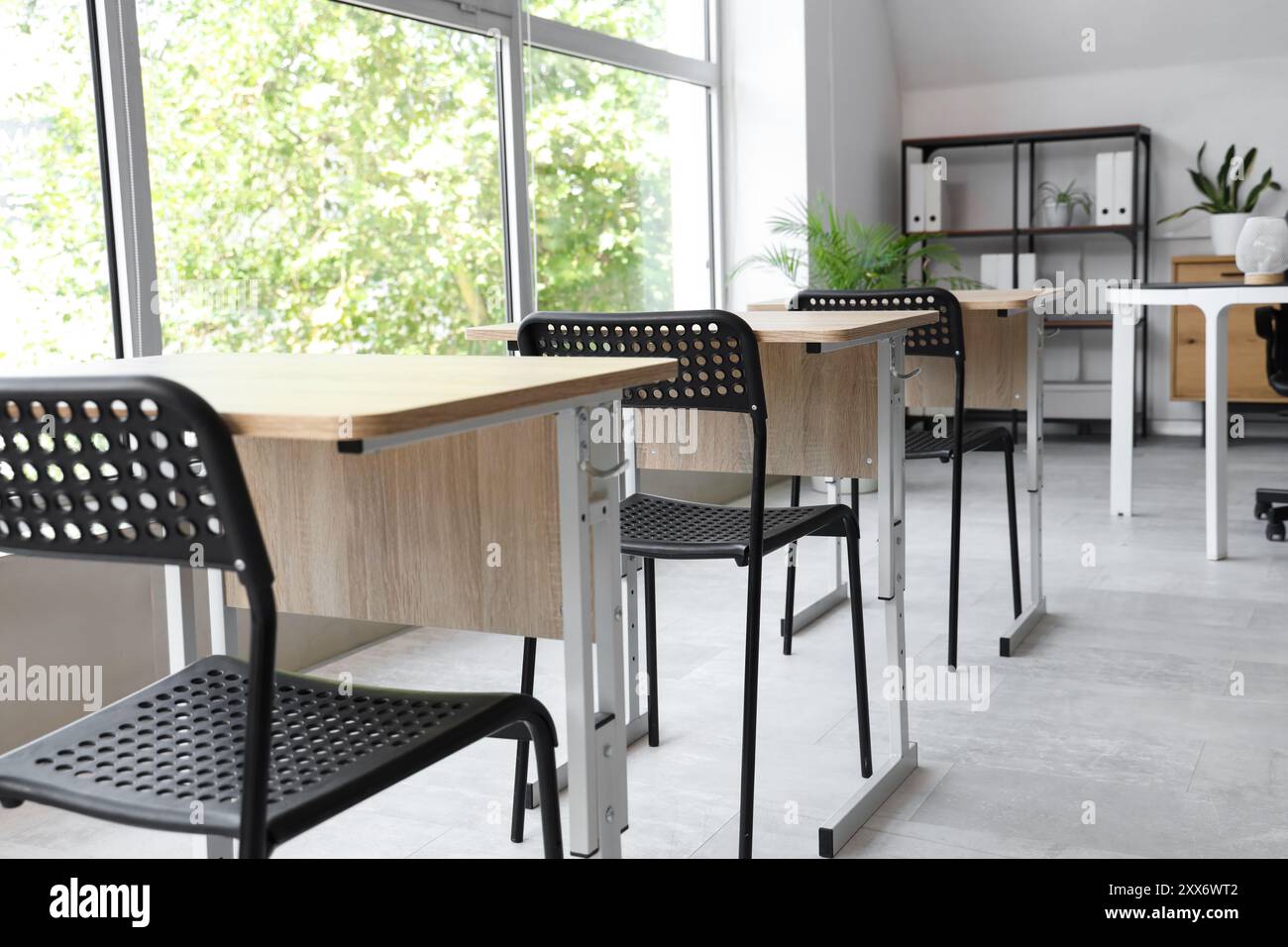 Desks and chairs in modern empty classroom Stock Photo - Alamy