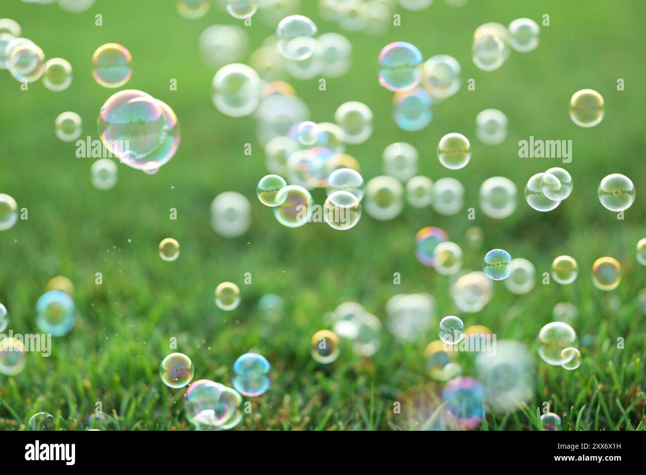 Many soap bubbles flying outdoors hi-res stock photography and images ...