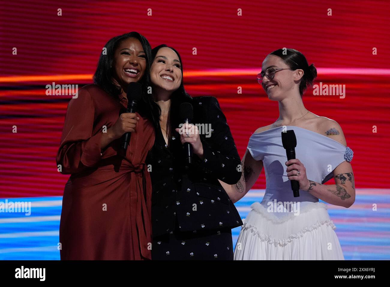 Helena Hudlin, from left, Meena Harris and Ella Emhoff speak during the ...