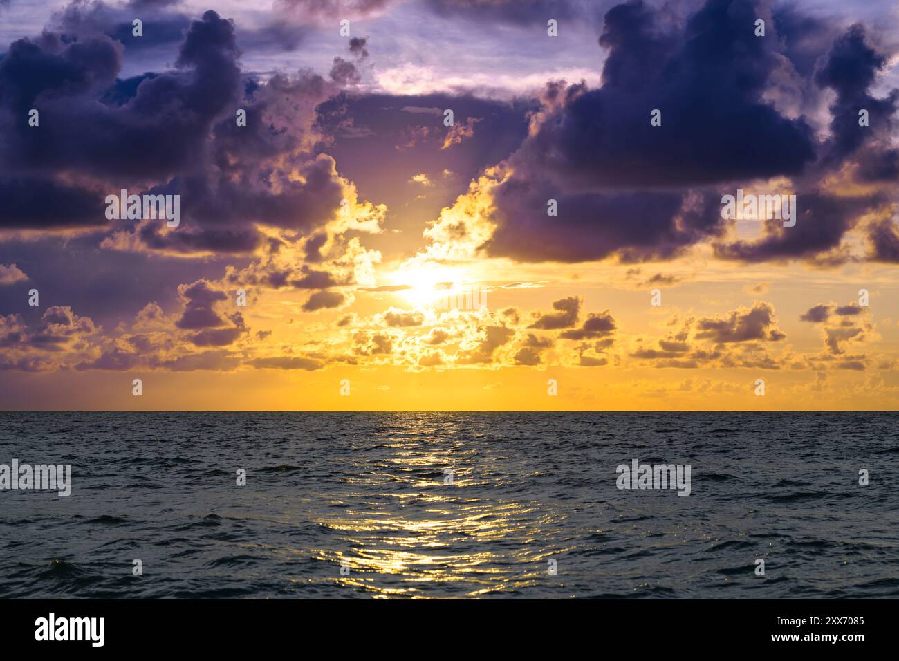 Dramatic sky and sun rays. Stormy cloud sky. Clouds above ocean. Dark ...