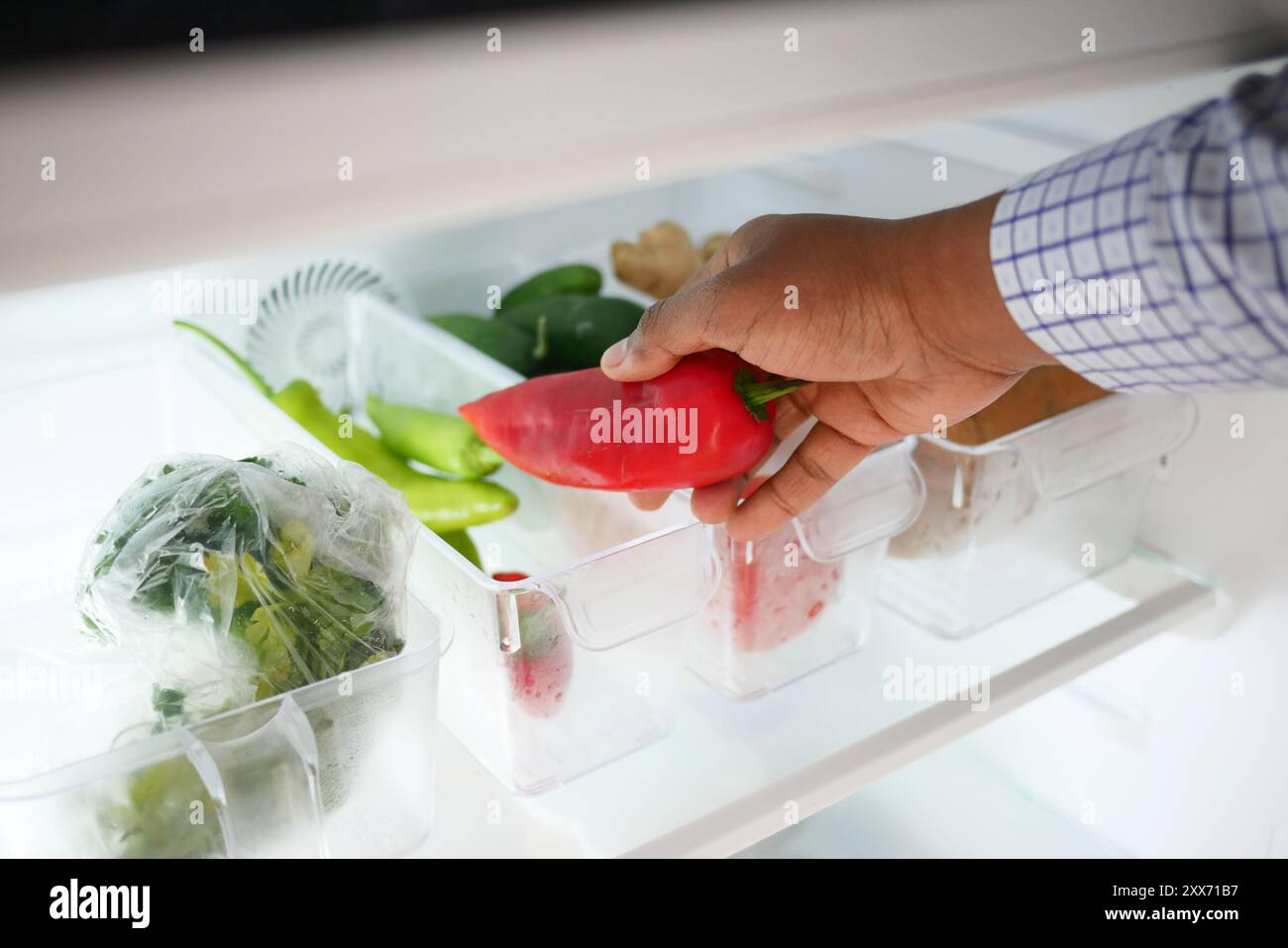 plastic containers with different fruits in a open fridge Stock Photo ...