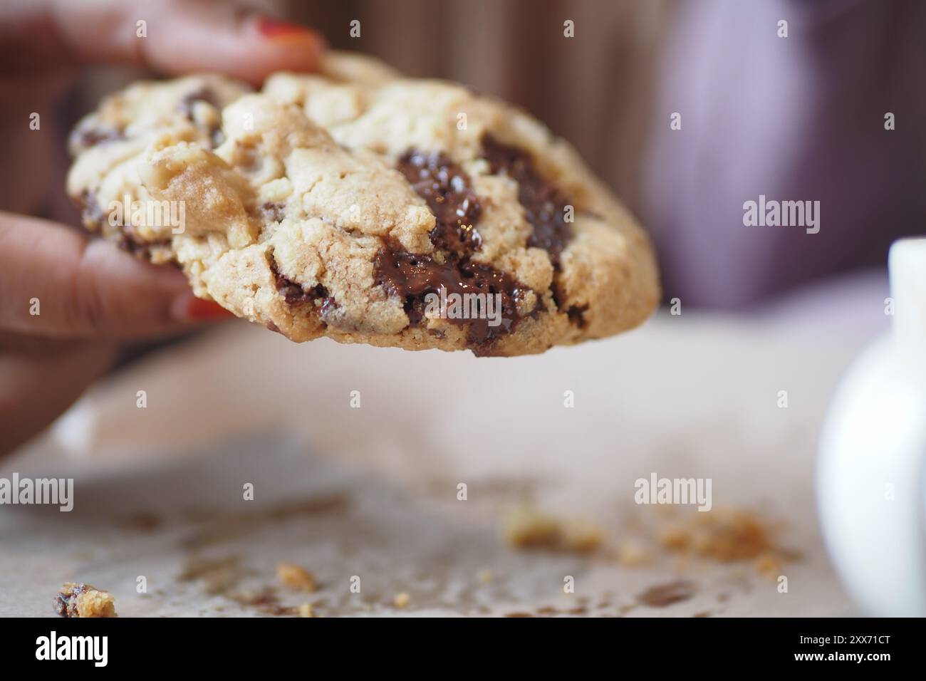 hand pick a chocolate chip cookie Stock Photo - Alamy