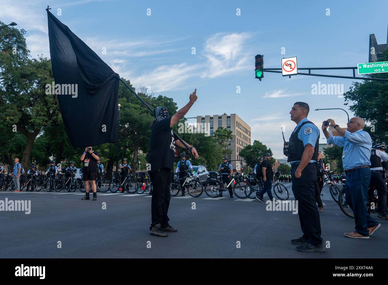 Chicago, Illinois, USA. 22nd Aug, 2024. An unidentified anarchist flips ...