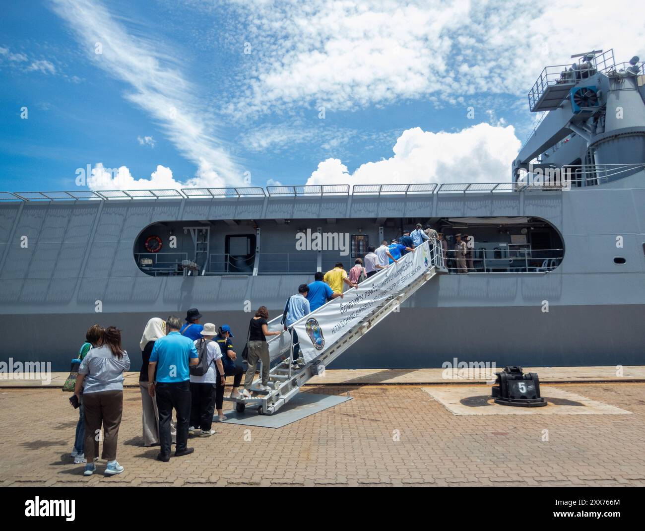Visitors are seen boarding HTMS Chang (LPD-792) to tour the interior of ...
