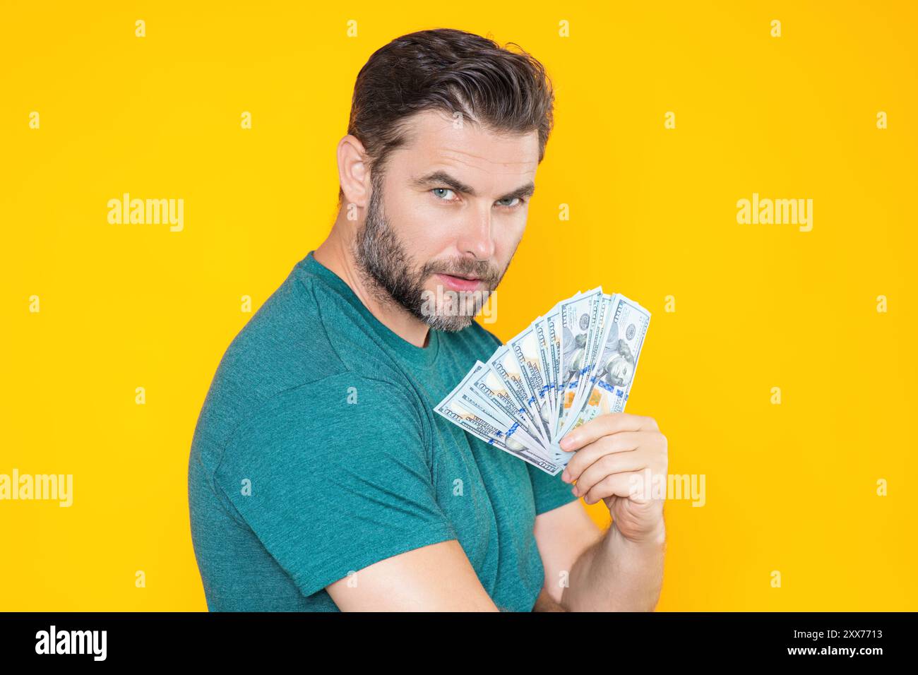 Business man counting money. Handsome middle age man holding bunch of ...
