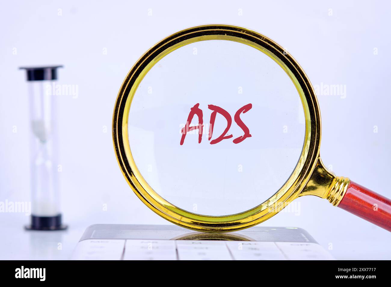 ADS word written through a magnifying glass on a uniform light ...