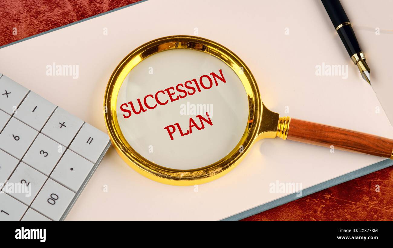 SUCCESSION PLAN word alphabet letters through a magnifying glass in red ...
