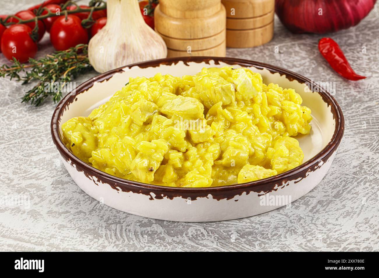 Italian cuisine - yellow risotto with chicken and soft cheese Stock ...