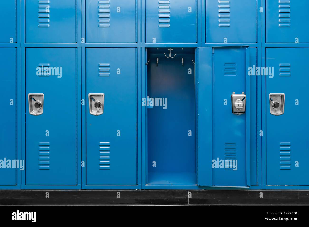 Single open empty blue metal locker along a nondescript hallway in a ...