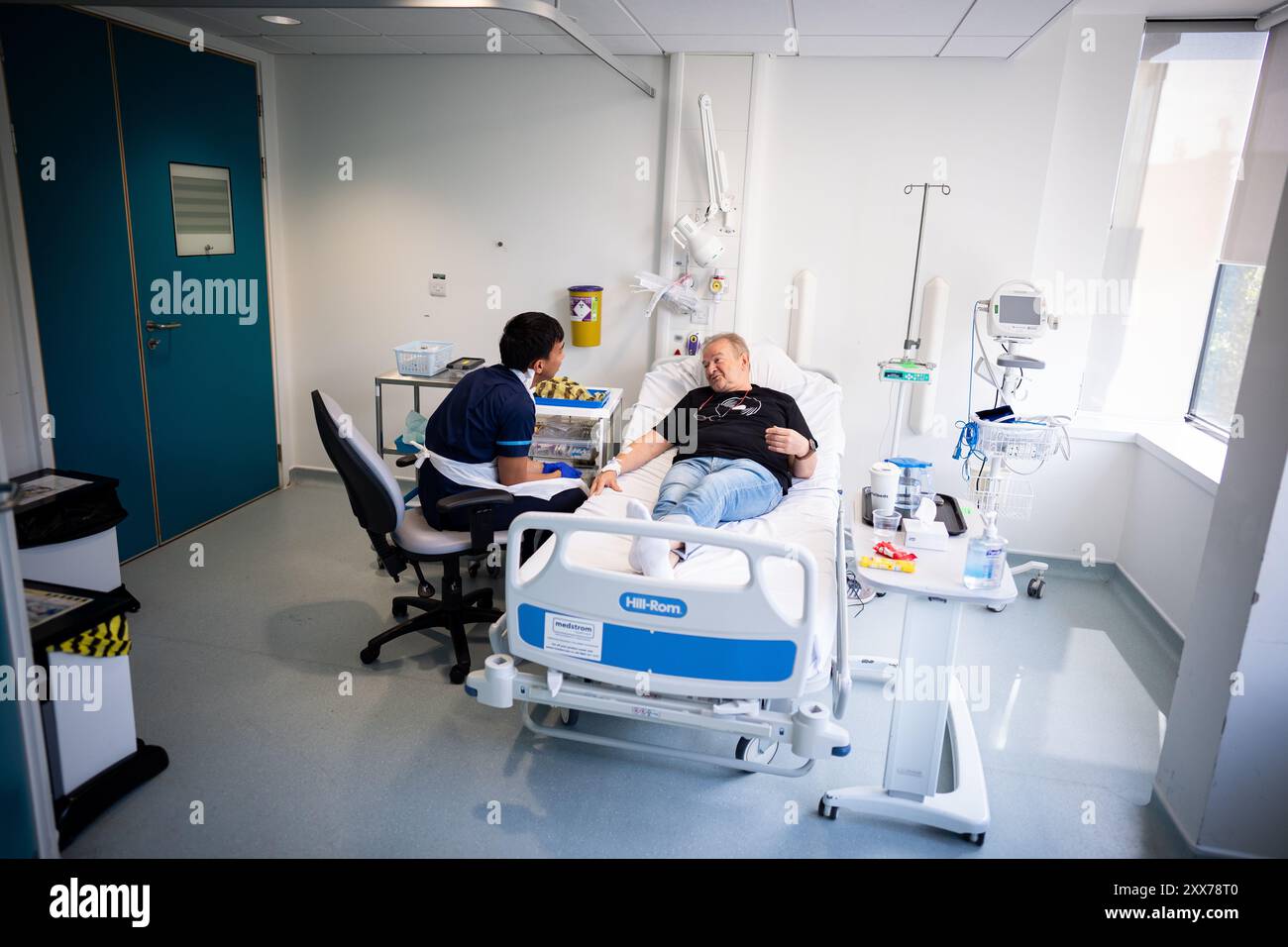 Patient Janusz Racz receives an injection of a BioNTech mRNA cancer ...