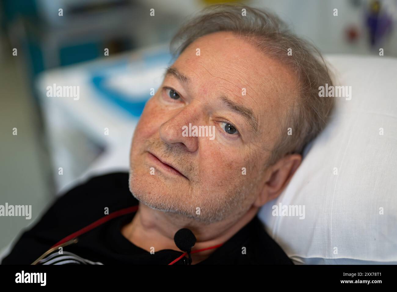 Patient Janusz Racz before receiving an injection of a BioNTech mRNA ...
