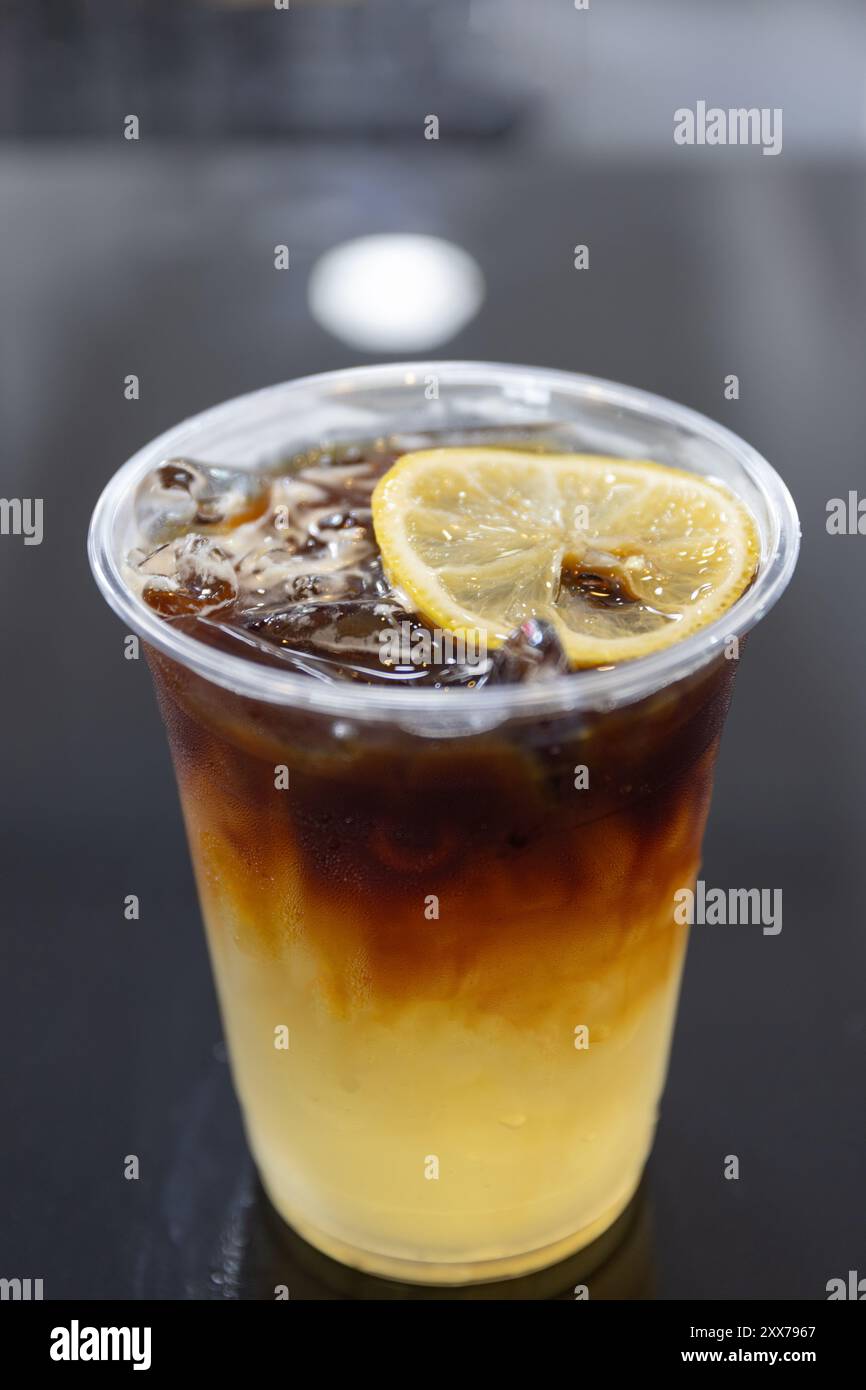 Perfect Summer Refreshment: Iced Coffee with Lemon Garnish, Served in a ...