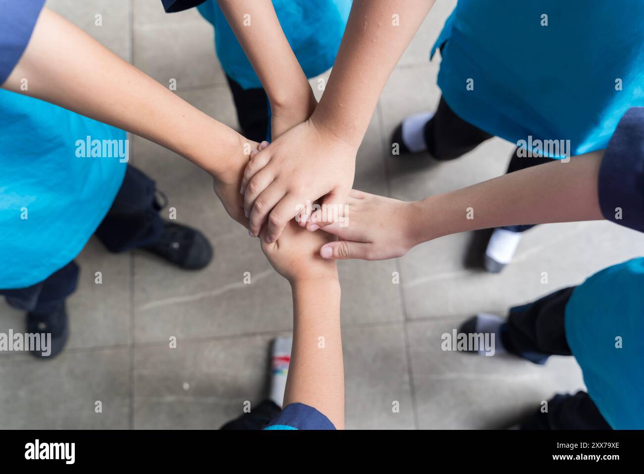 Volunteers unite during community charity event. United hands of happy ...