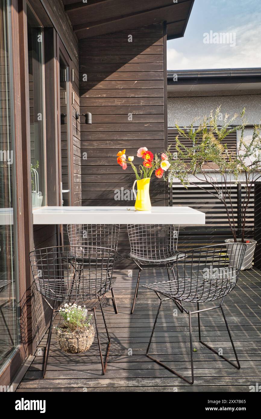 Terrace in a private apartment in Tokyo, Japan. A colorfull vase with ...