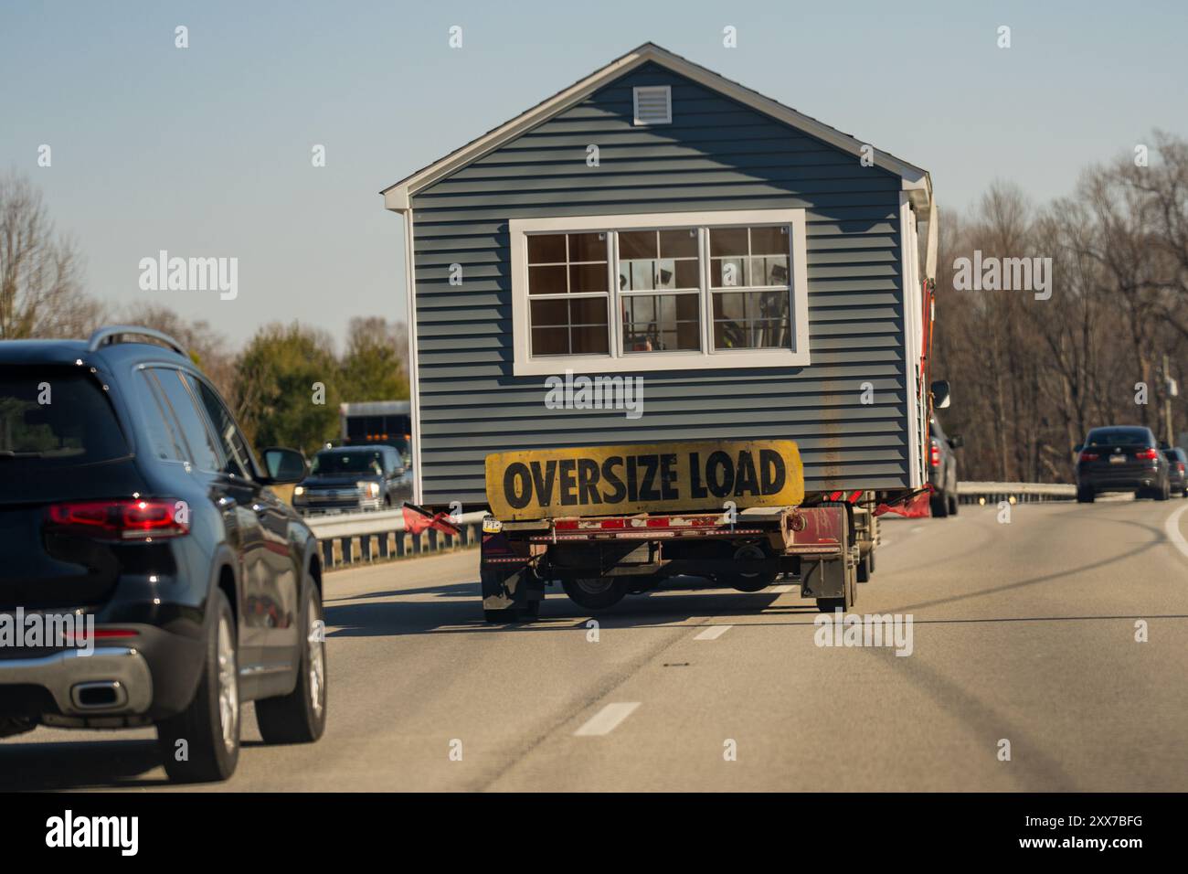 Oversize load. Manufactured house transported on the highway. Mobile ...