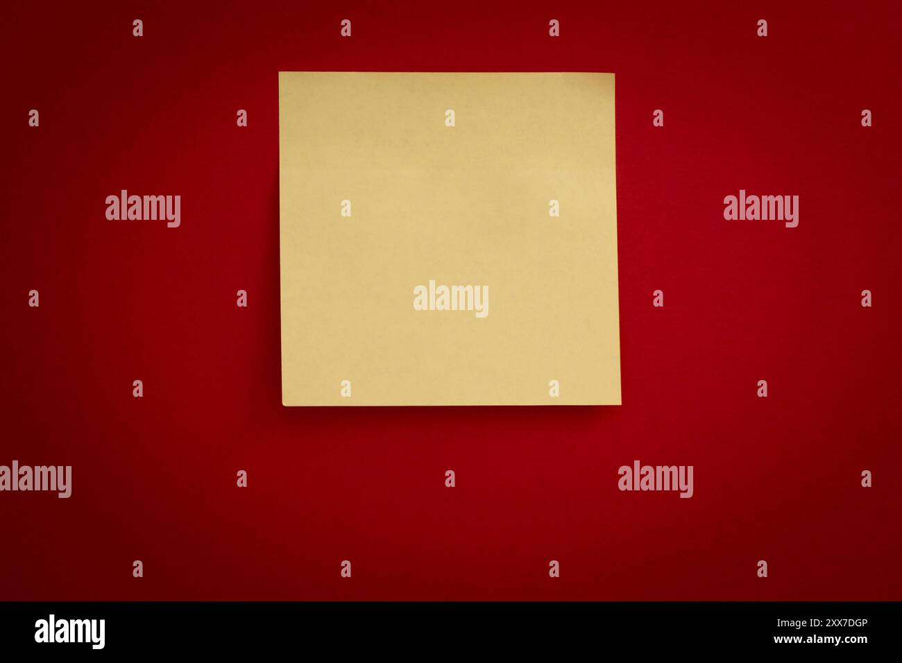 close up of blank yellow note sticked to red wall Stock Photo - Alamy