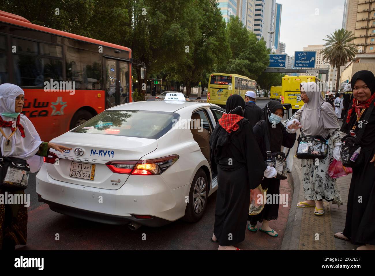 Mecca, Saudi Arabia - June 10, 2024: Indonesian Hajj in Saudi Arabia use taxi during Hajj season ...