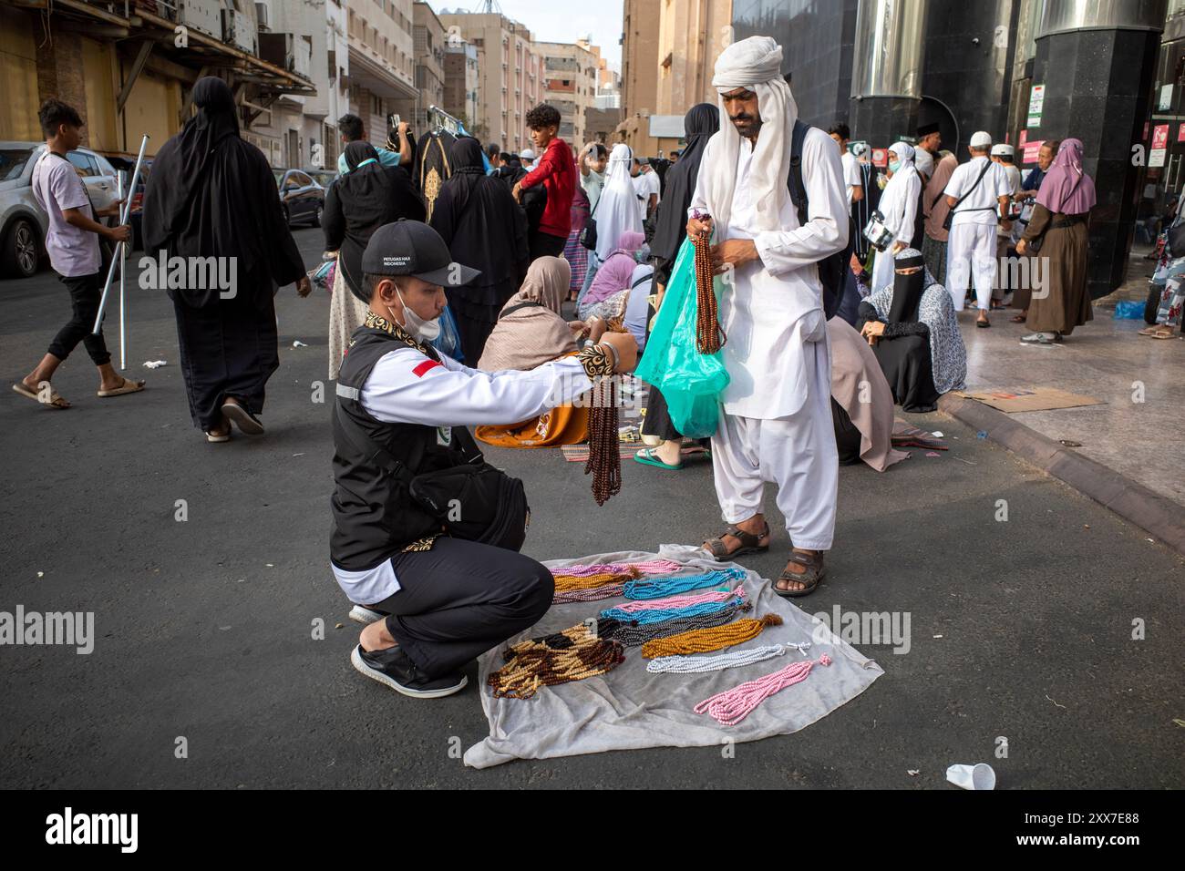 Mecca, Saudi Arabia - June 9, 2024: Petugas Haji Indonesia, Indonesian Hajj Officers buy prayer ...