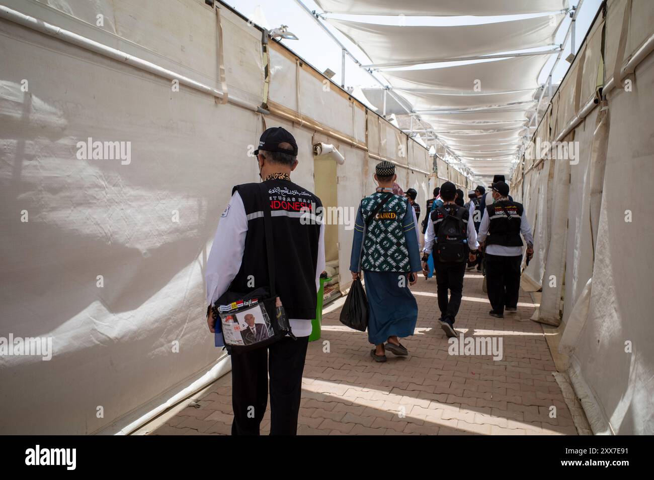 Mecca, Saudi Arabia - June 9, 2024: Petugas Haji Indonesia, Indonesian Hajj Officers walking in ...