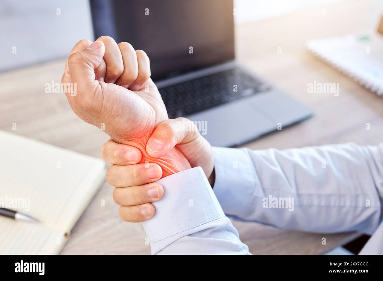 Arthritis, injury or wrist pain with business man at desk in office ...