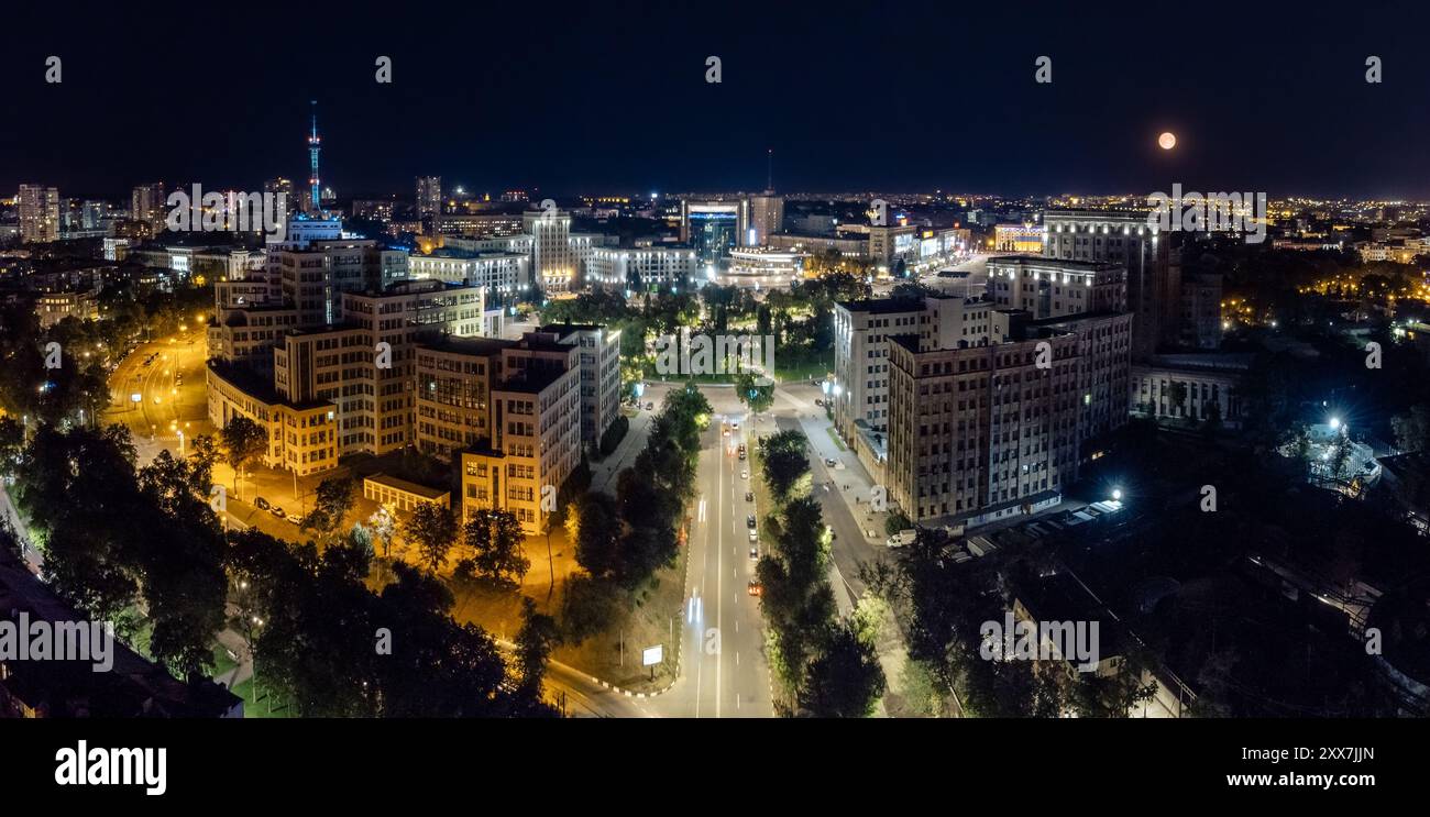 Aerial night illuminated Freedom Square panorama with Derzhprom and ...