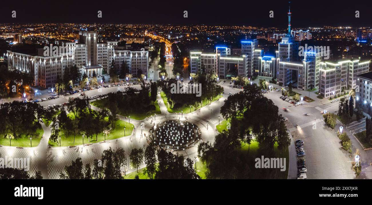 Aerial night Derzhprom and University buildings with illumination and ...