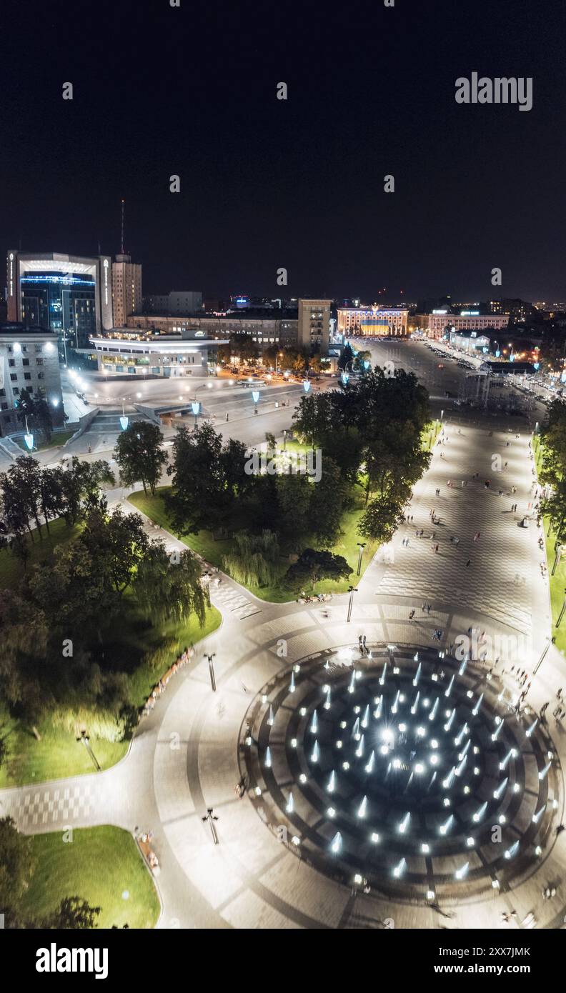 Aerial night Freedom Square vertical panorama with fountain and hotel ...