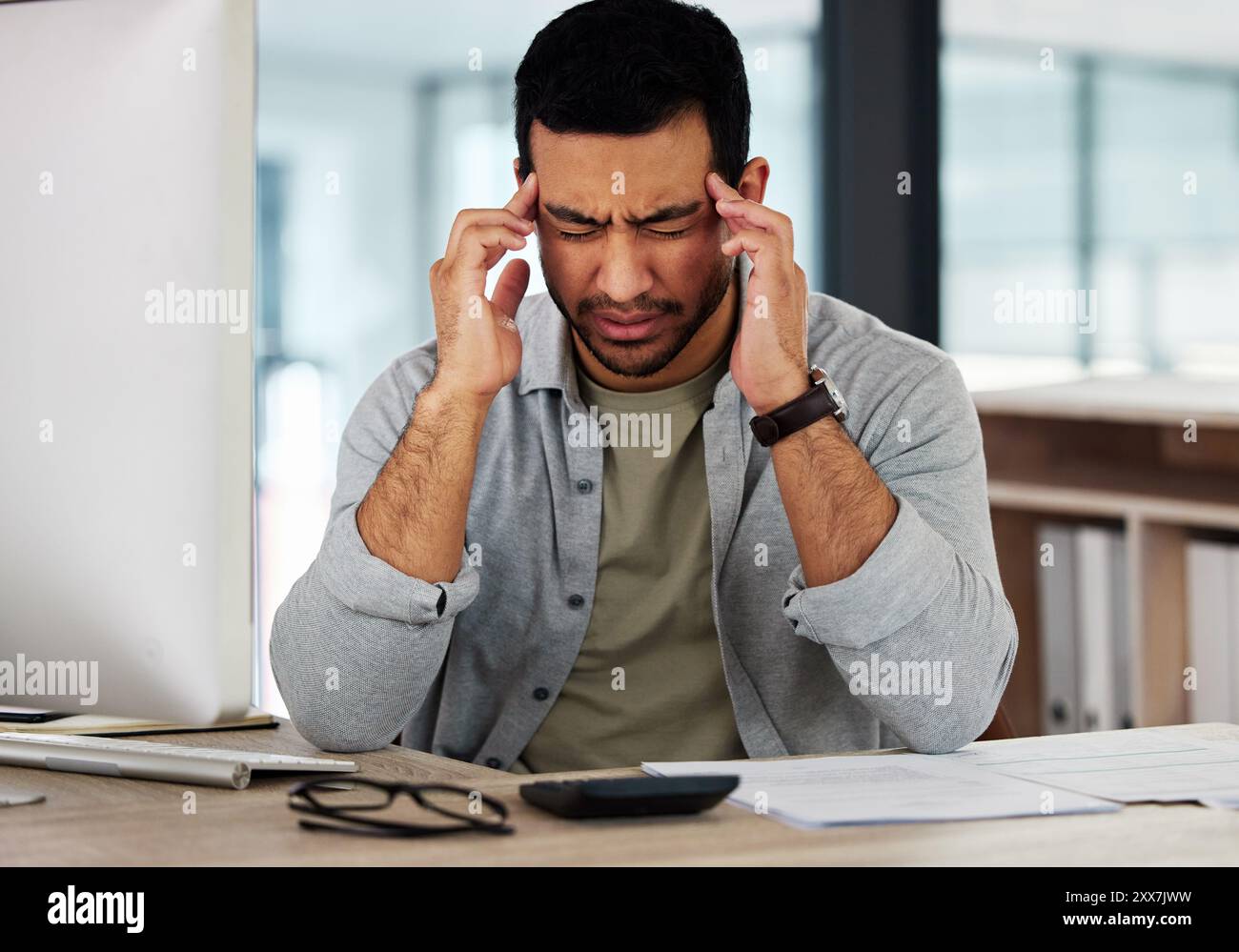 Businessman, headache and pain of stress in office, computer glitch and ...