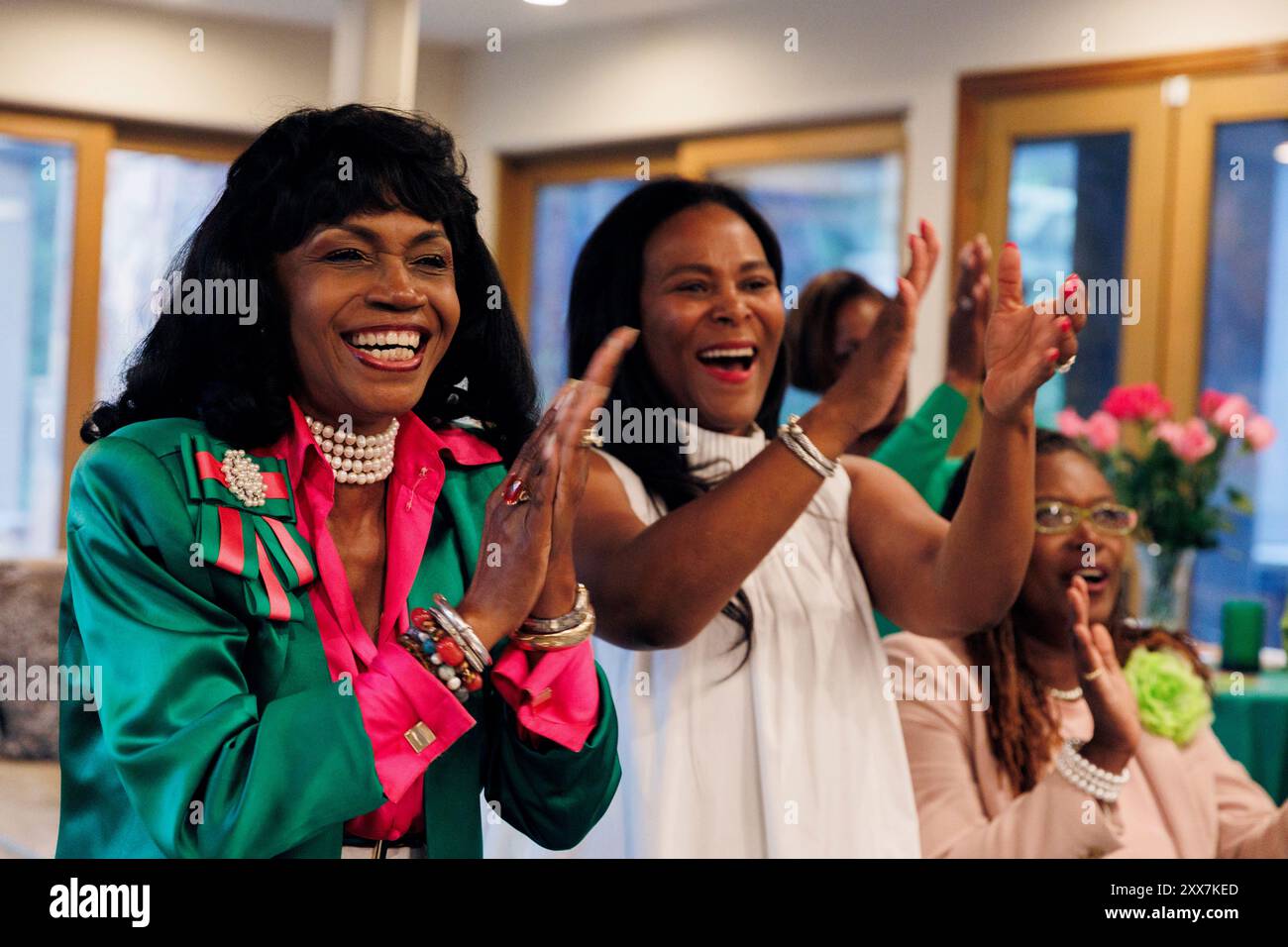 Jackie Welch, left, and Felicia Mayo, right, of the Rho Delta Omega Chapter of Alpha Kappa Alpha ...