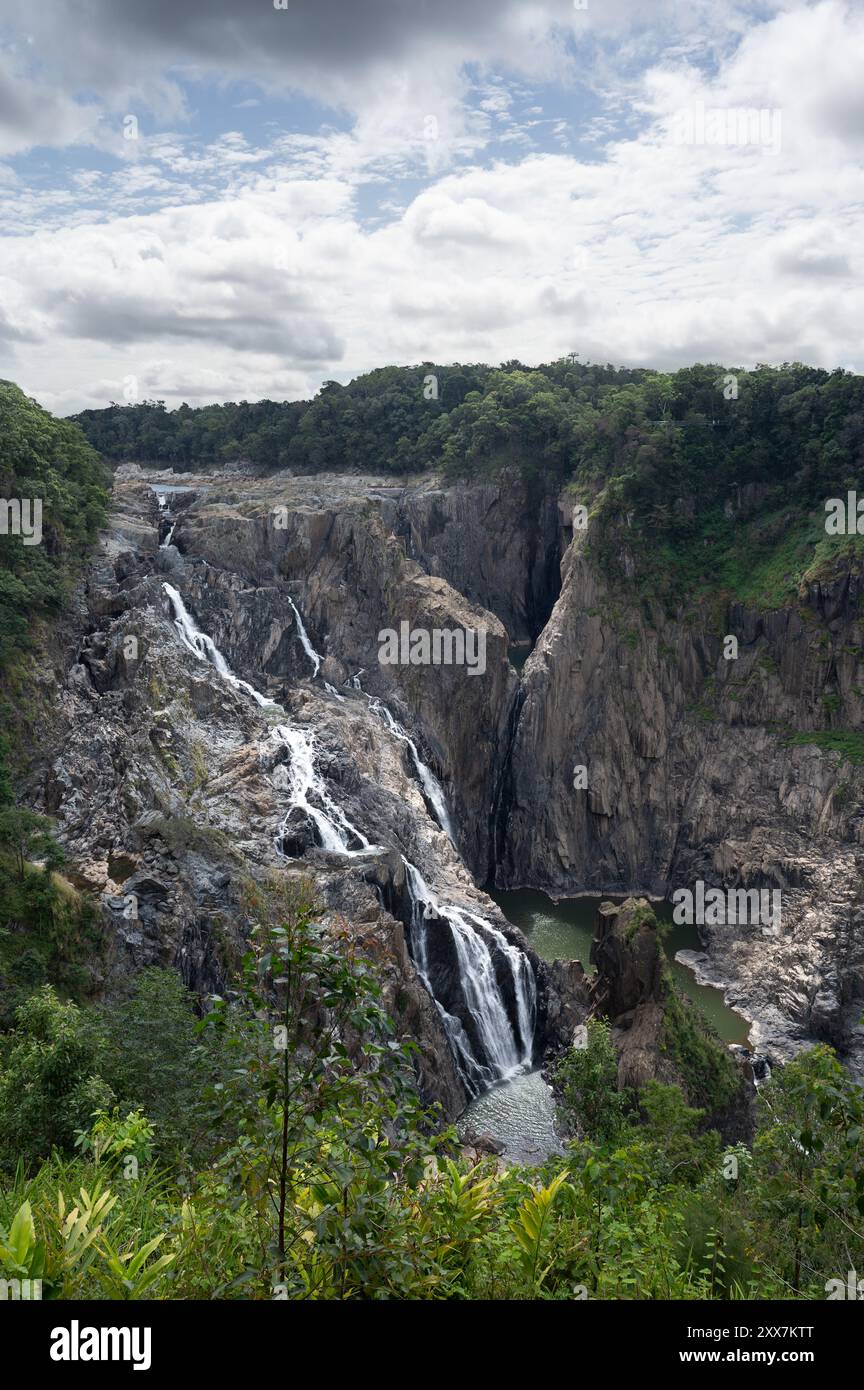 A portrait view of the Barron Falls cascading down the scenic chasm on ...