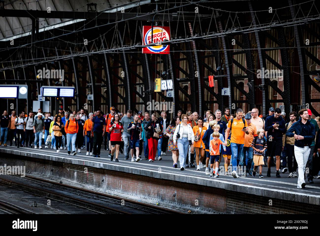 AMSTERDAM - Race fans at Amsterdam Centraal en route by train to ...
