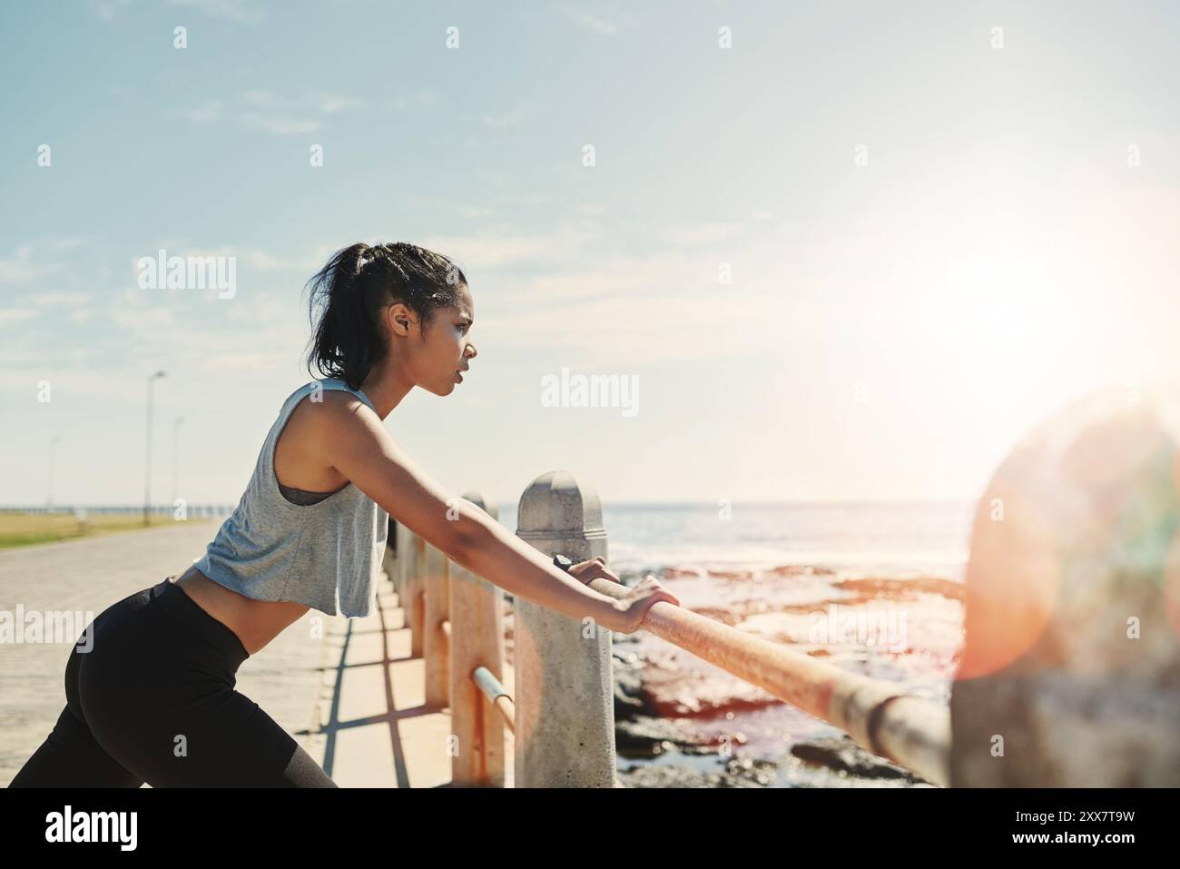 Outdoor, woman and stretching on beach for fitness, cardio and prepare ...
