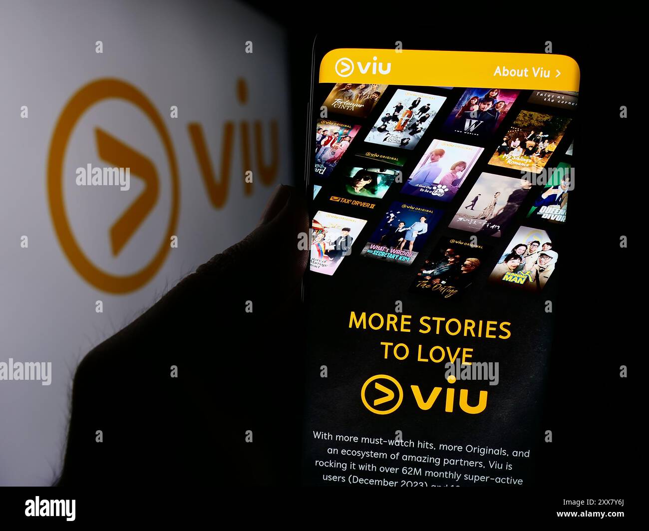 Person holding cellphone with webpage of Hong Kong streaming service ...