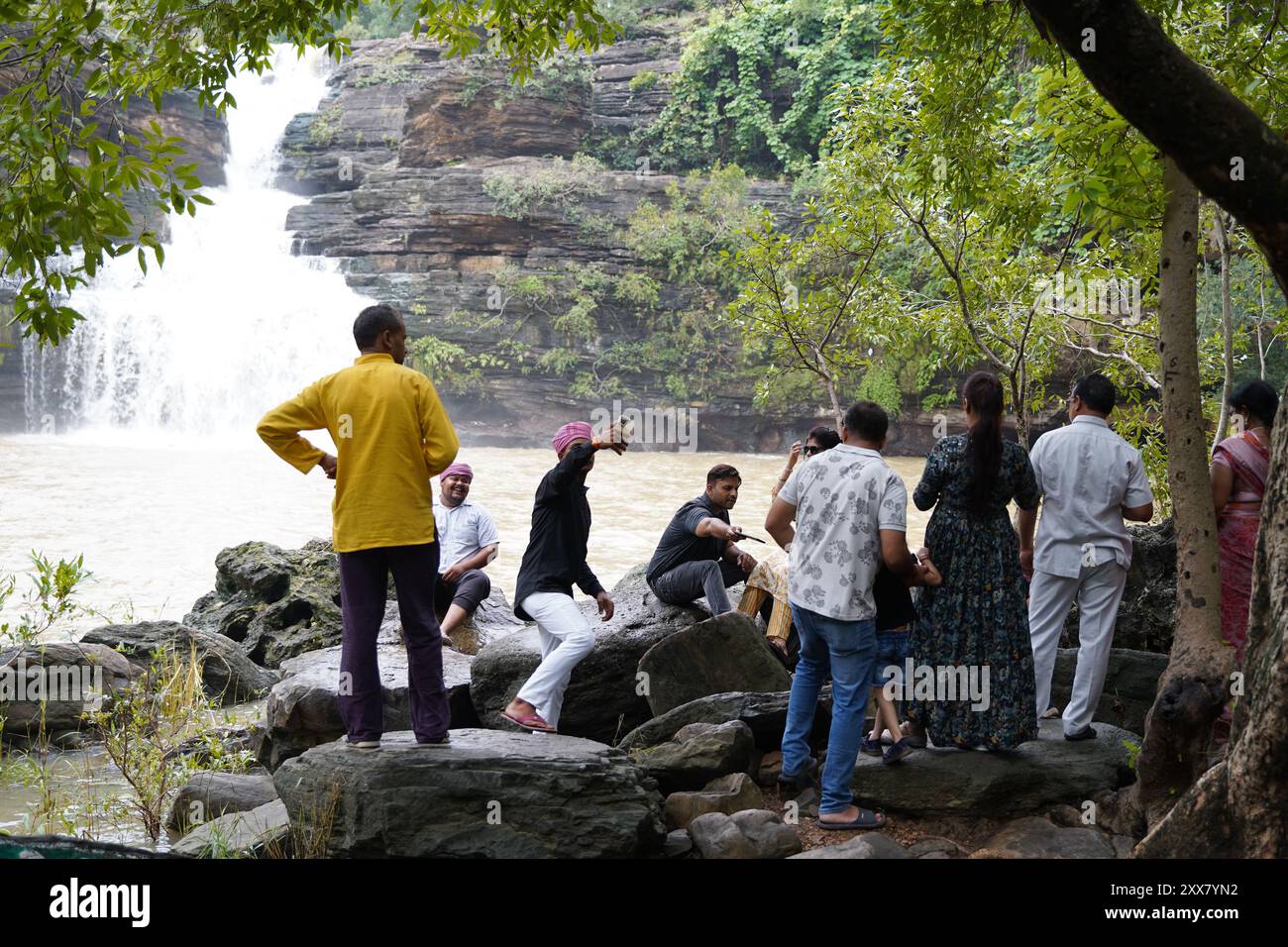 Tourists enjoing at the Pandav Falls, nestled within Panna National ...