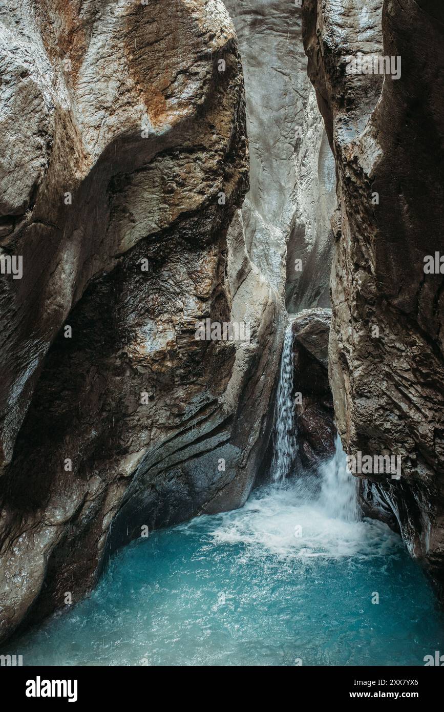Turquoise water flows through rocky formations in Rosenlaui Canyon Stock Photo - Alamy