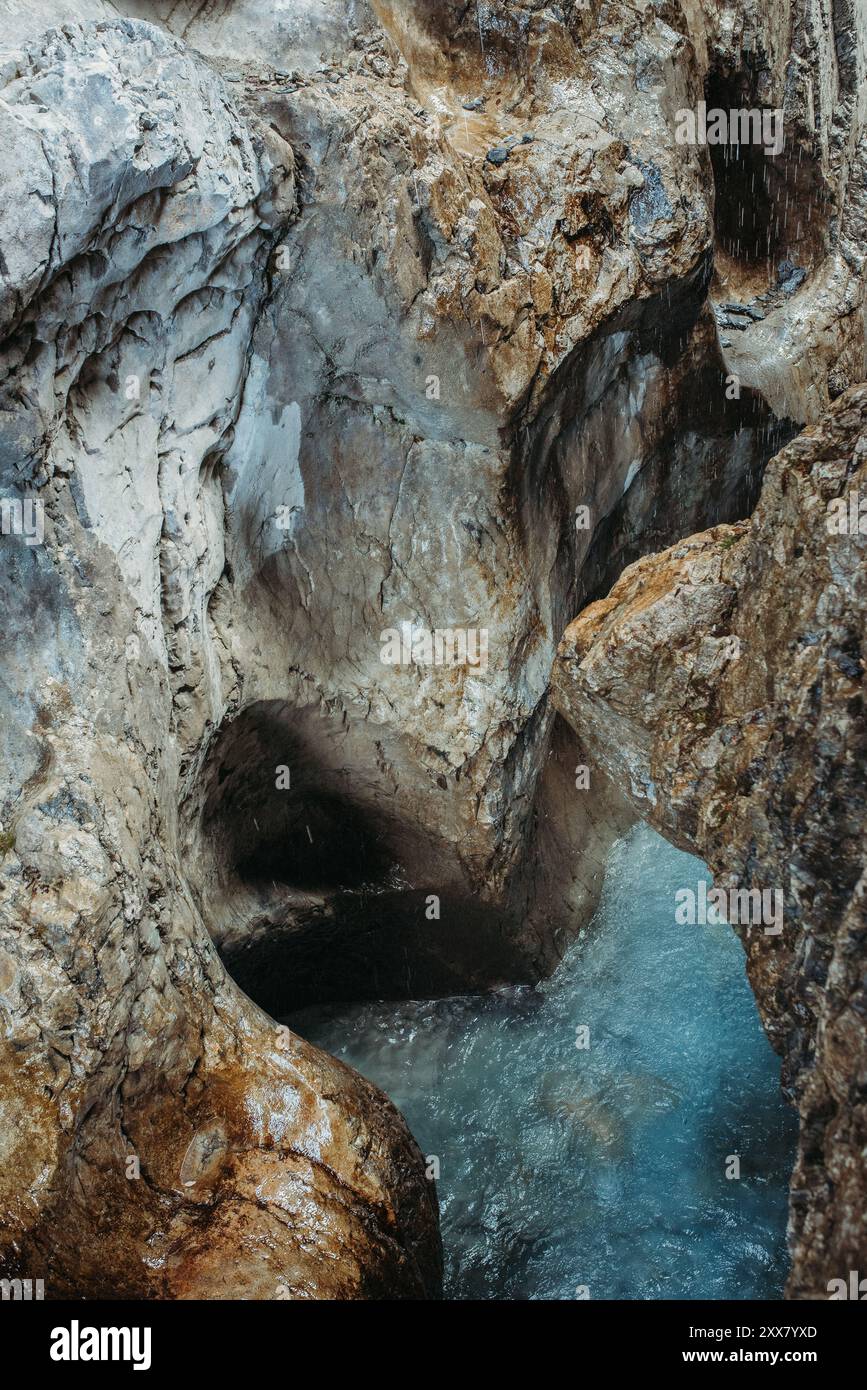 Turquoise water flows through rocky formations in Rosenlaui Canyon Stock Photo - Alamy