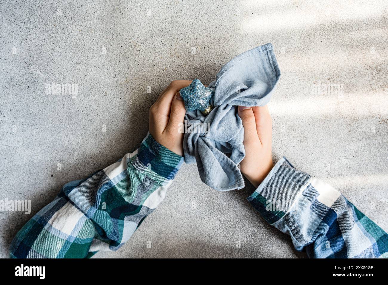 Christmas gidt box in the hand of boy Stock Photo - Alamy